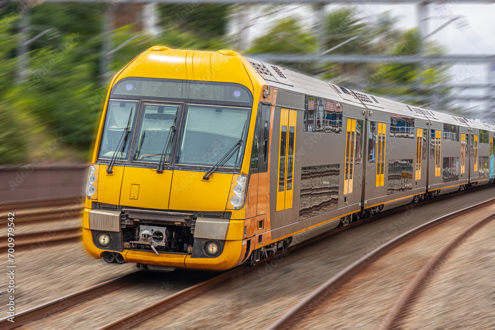 Commuter Train fast moving through a Station in Sydney NSW Australia ...