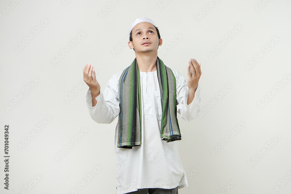 happy asian muslim man praying hand gesture, holding palm face up ...