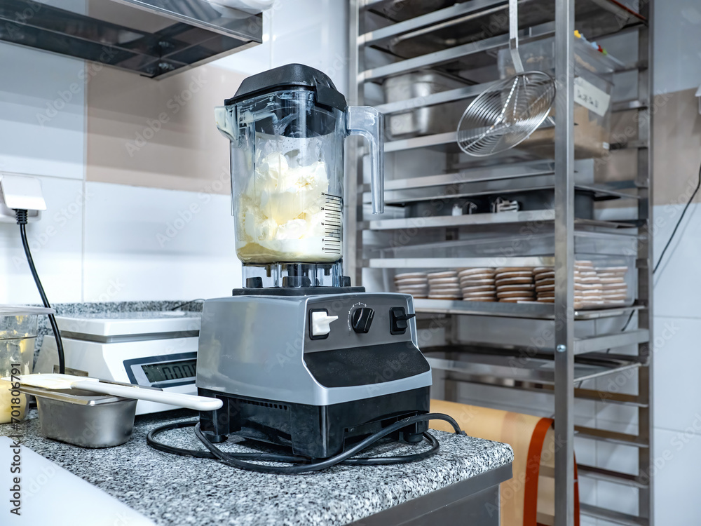 Mixer in restaurant kitchen. Equipment for confectionery shop. Butter ...
