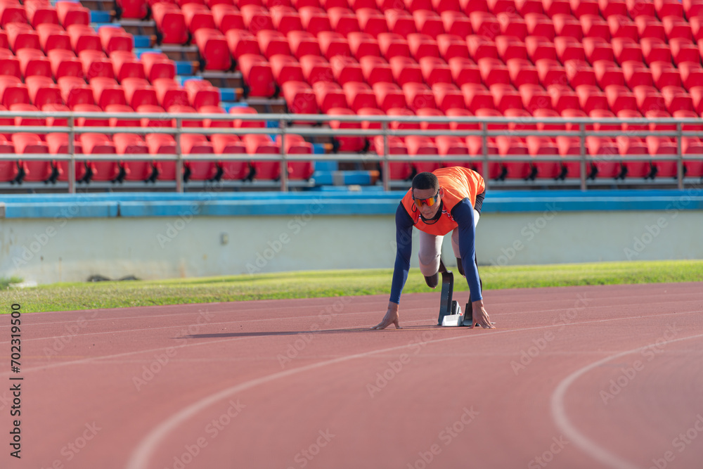 Disabled athletes prepare in starting position ready to run on stadium ...