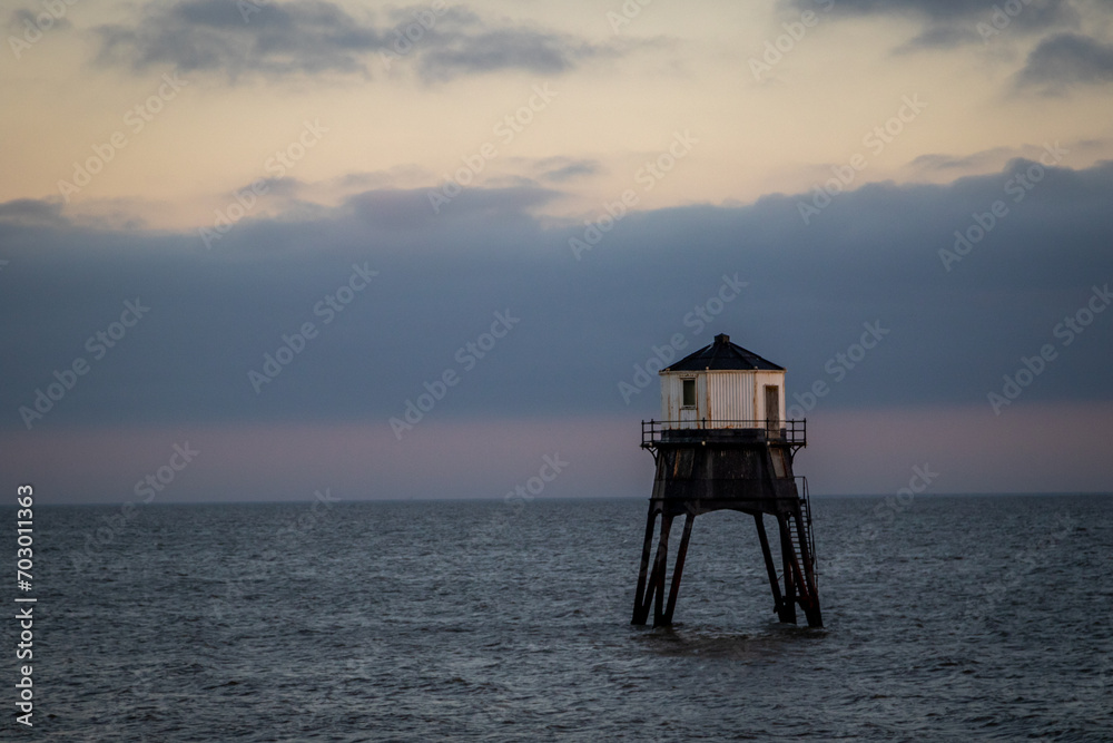 Lighthouse in the sea at sunset, Dovercourt low lighthouse at high tide ...