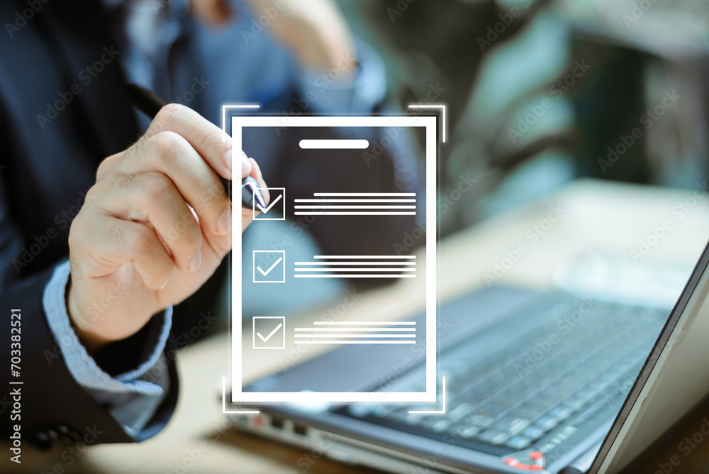 Business performance internet checklist. Businessman use computer ...