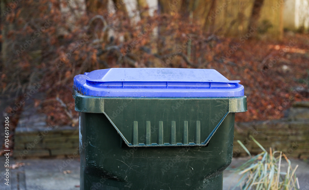 Minimalist steel trashcan against white backdrop, clean lines and ...