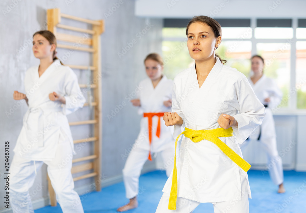 In gym, certified woman master coach conducts karate kata lesson with ...