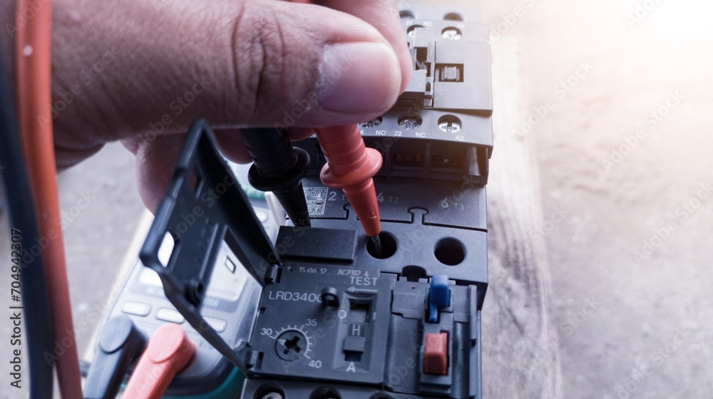Checking magnetic contactor terminals using a multimeter, magnetic ...