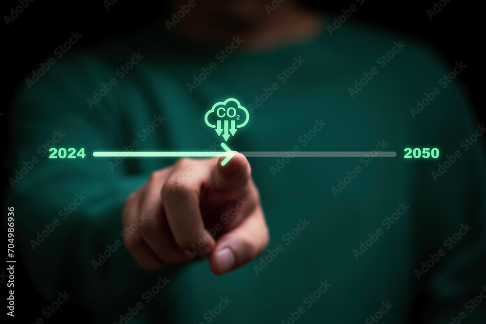 Hand touching to reduction carbon icon to move download bar to 2050 ...