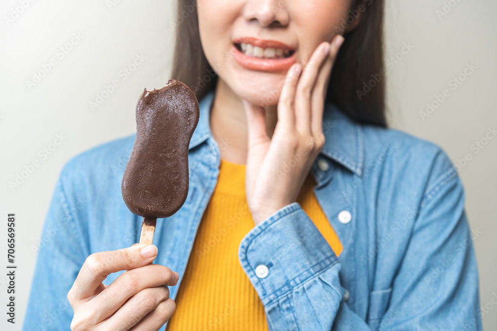 Face expression suffering from sensitive teeth and cold, asian young ...