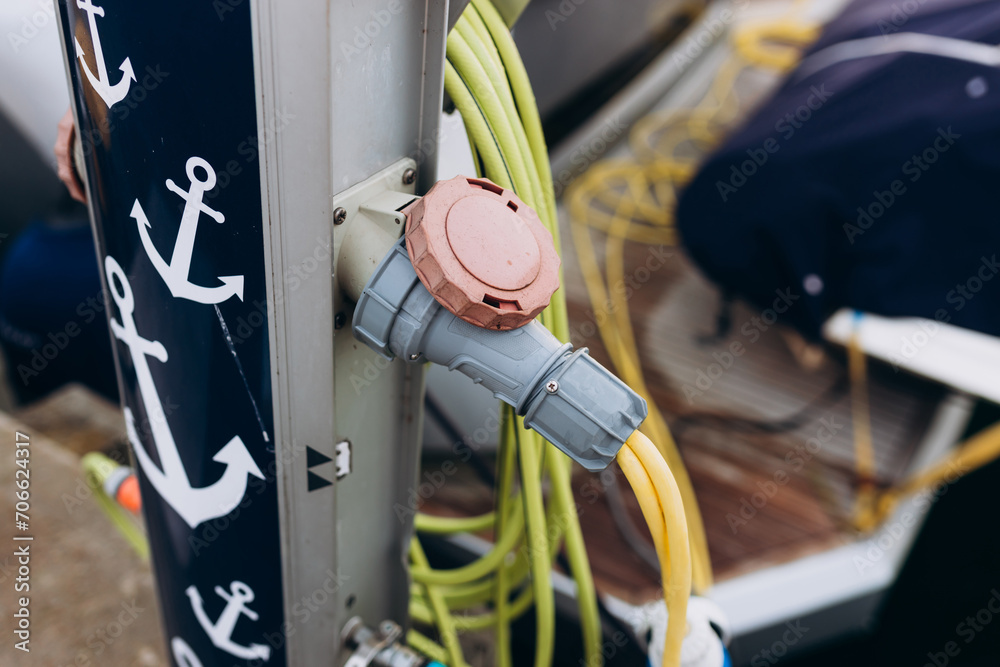 Electrical outlets to charge ships in harbor. Electrical power sockets ...