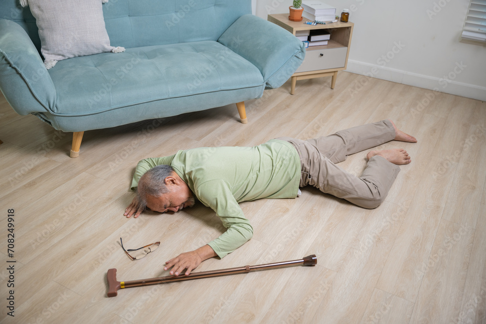 Older senior man headache lying on the floor after falling down he pain ...