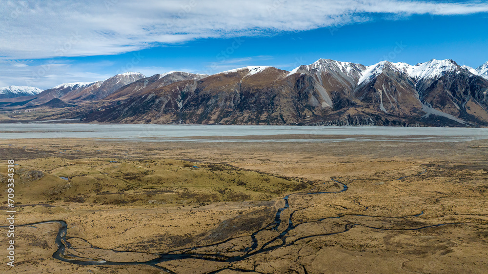 Drone photo of the arid desert like Hakatere Valley and southern alps ...