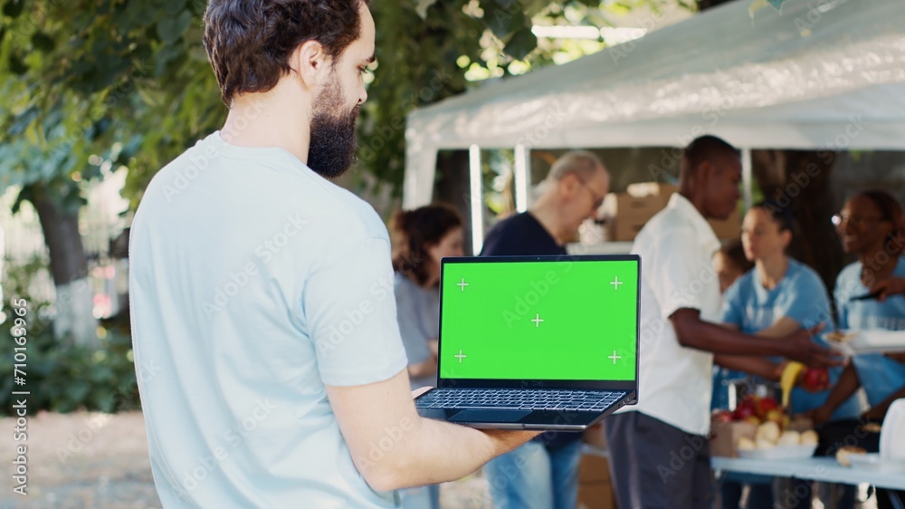 Stock-Foto „Detailed view of young man carrying laptop with isolated ...