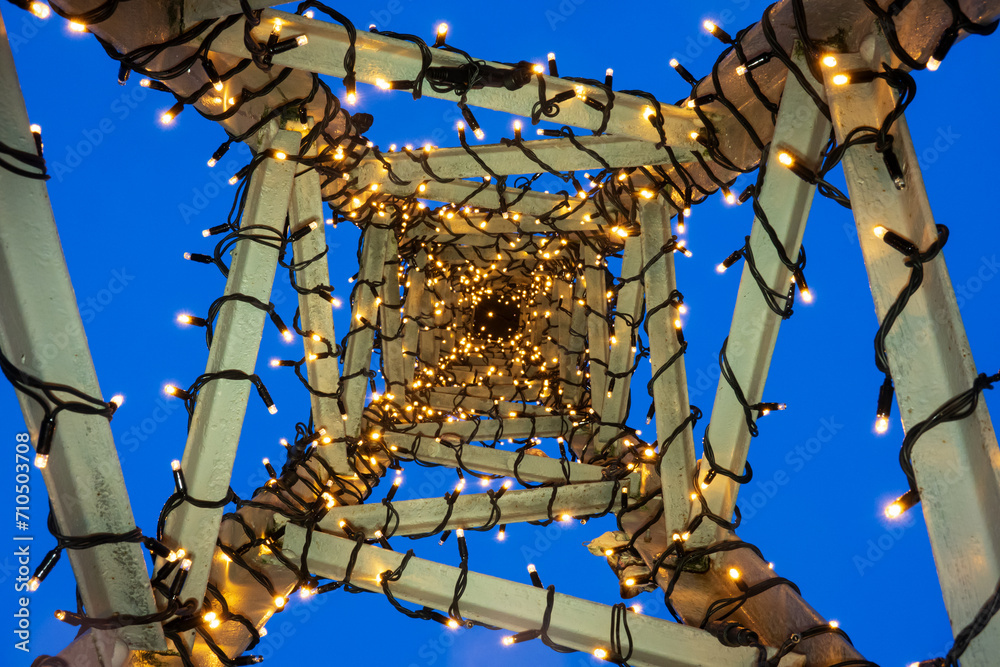 Looking up inside an antique metal post made of steel elements. The ...