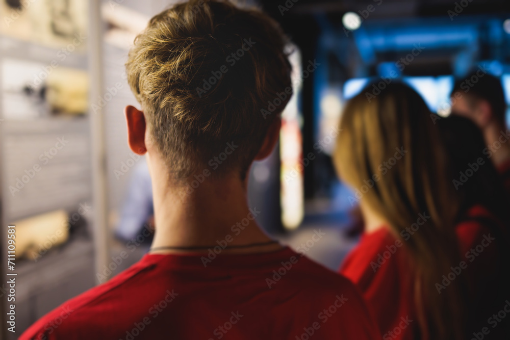 Group of students and school pupils in a science museum exhibition ...