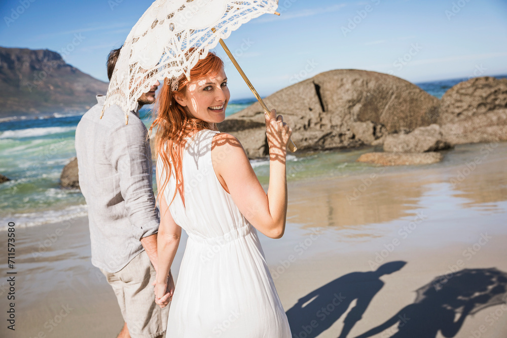 Couple getting married on the beach, boho style wedding, with loads of ...