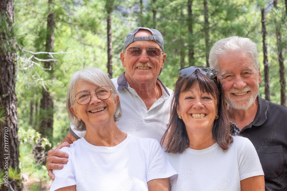 Joyful group of senior friends enjoying retirement trekking in the ...