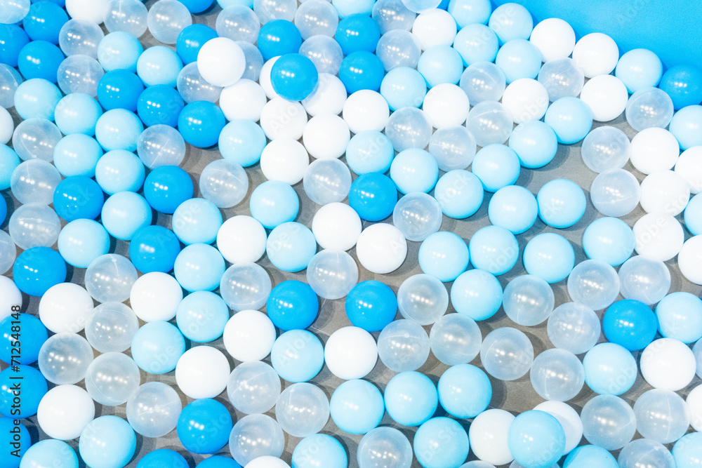 Colored plastic balls in pool of kindergarten school,White and blue ...