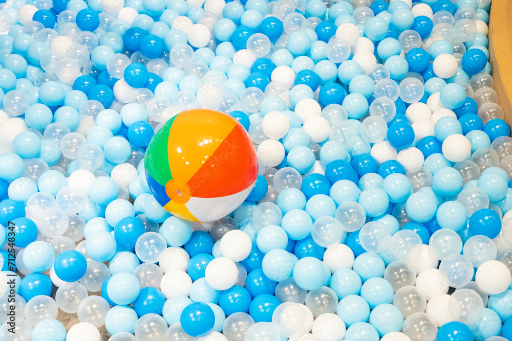 Colored plastic balls in pool of kindergarten school,White and blue ...