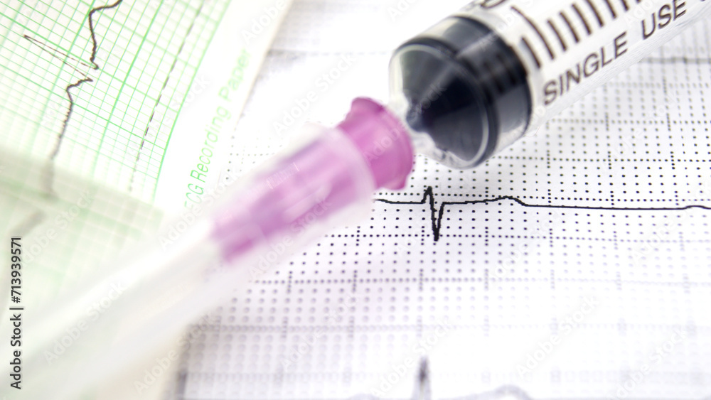 Record the heart rhythm ekg on a piece of paper with a syringe placed ...