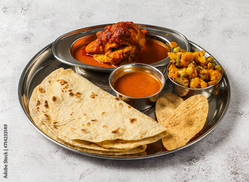 chicken thali set with chicken korma, mixed vegetable of aloo gobi ...