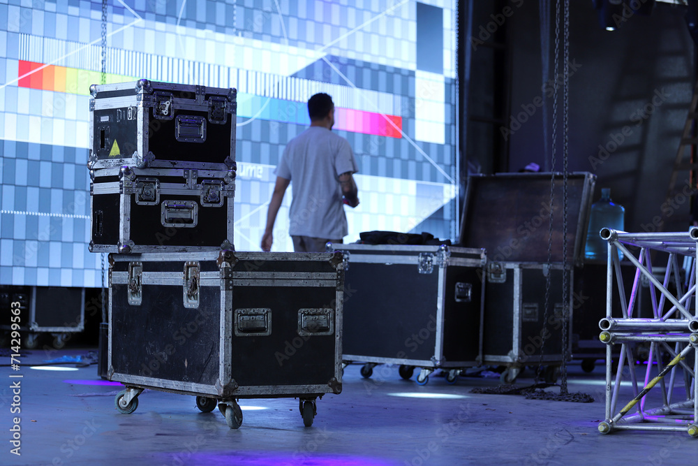 Technicians working setting up a stage with giant LED screens. Drawers ...