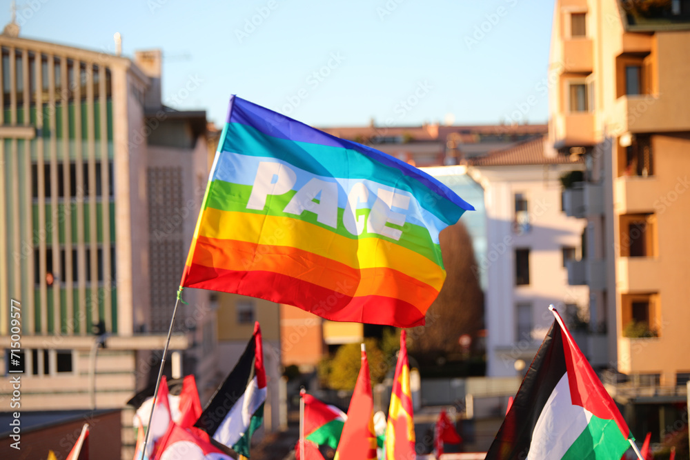 peace flag and other flags, including the Palestinian one, with the ...