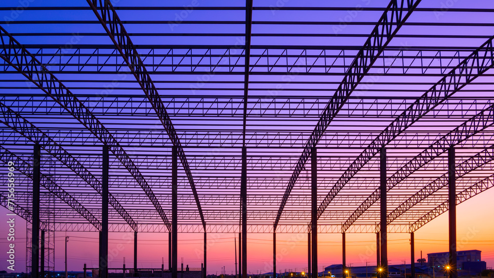 Silhouette of curve metal roof beam and column of large factory ...