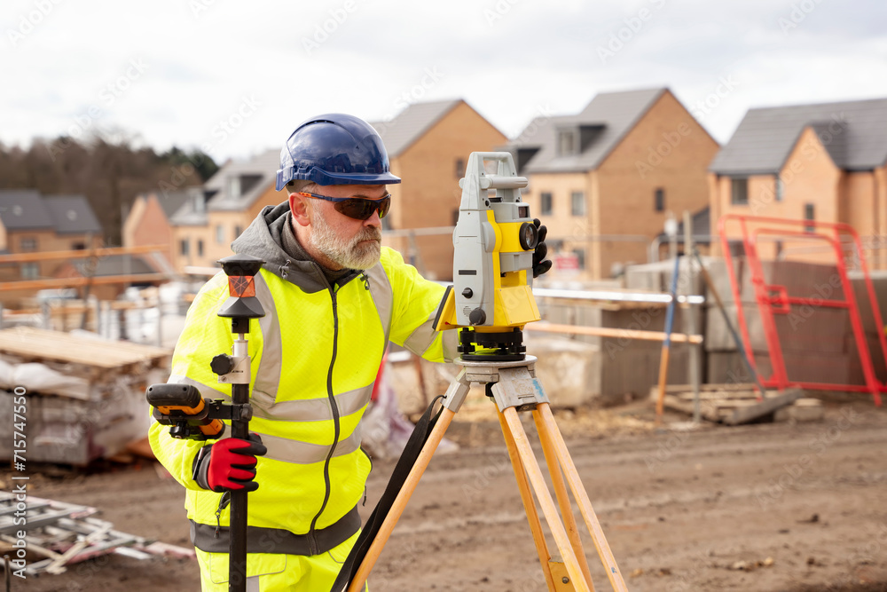 Surveyor builder site engineer with theodolite total station at ...