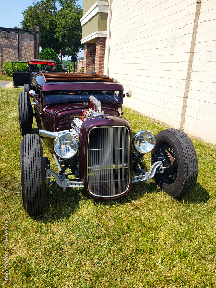 Customized classic lowrider hot rod roadster with exposed engine, big ...