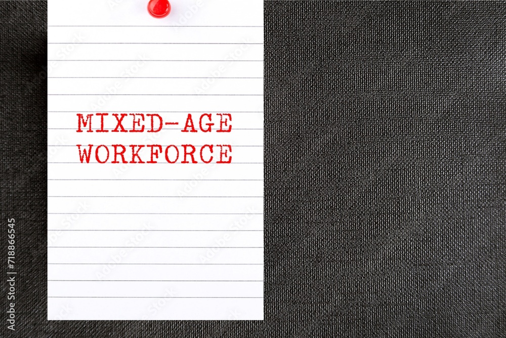 Pinned paper on office wall with text written MIXED-AGE WORKFORCE ...