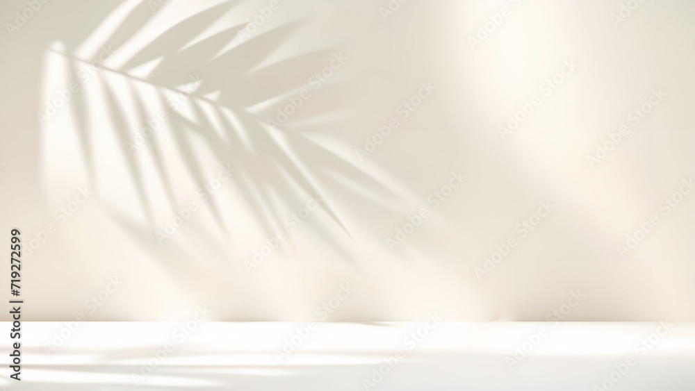 Blurred shadow from palm leaves on light cream wall. Minimalistic ...