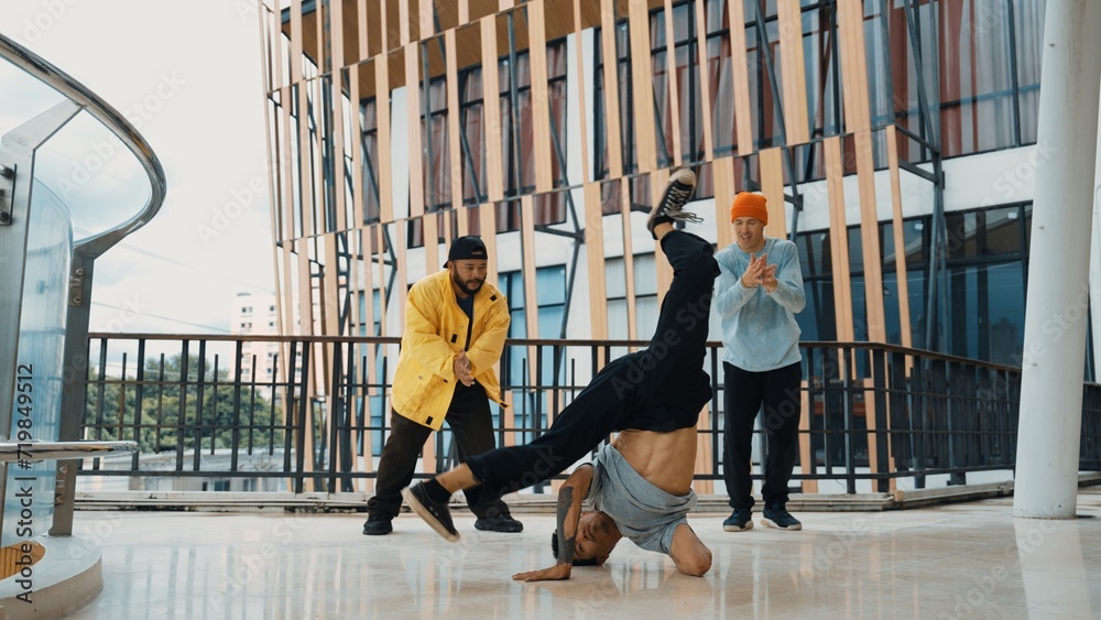 Hip hop team dance break dance while multicultural friend surrounded ...