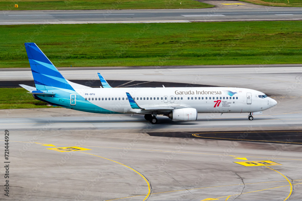 Garuda Indonesia Boeing 737-800 airplane at Changi Airport in Singapore ...