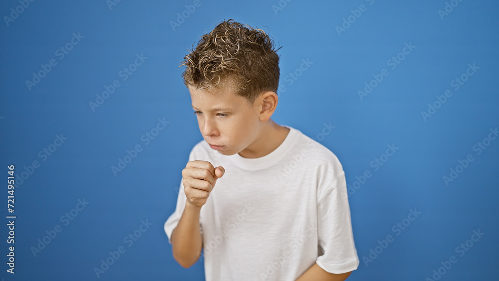 Photo Stock Adorable blond boy, a little sick kid, seriously coughing ...