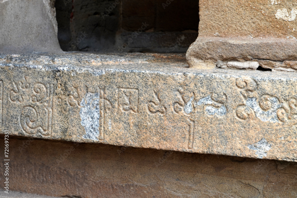 Foto de Stock Inscriptions of Tamil language carved on the stone walls ...