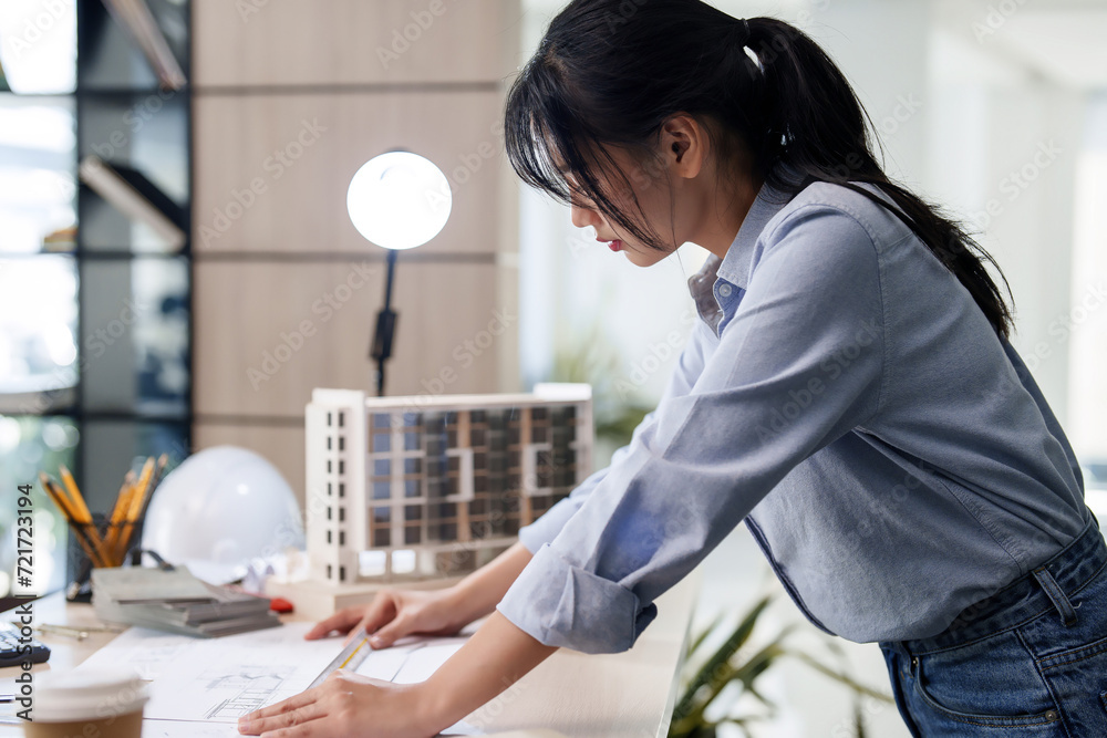 Foto de Stock Asian architect engineer women using ruler to checking ...