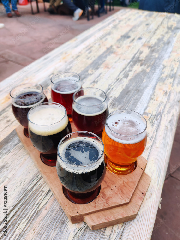 Beer samples on beer garden outside restaurant table drink background ...