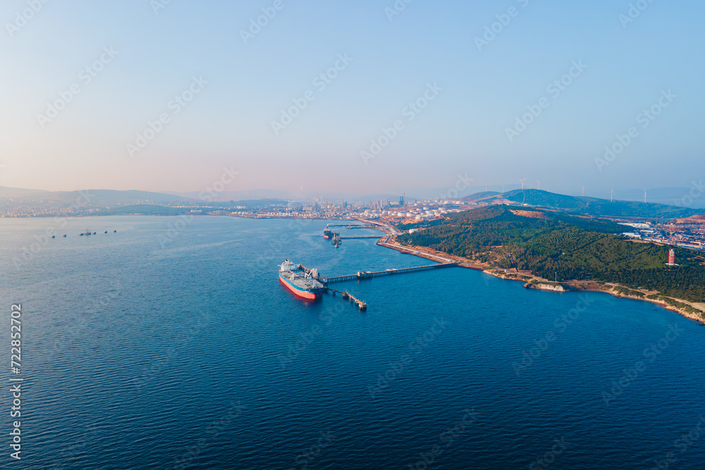 Crude oil tanker ship carrier is loading in oil berth petrochemical ...