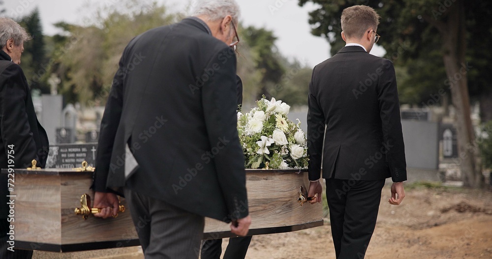 Coffin, men and pallbearers walking at graveyard ceremony outdoor at ...