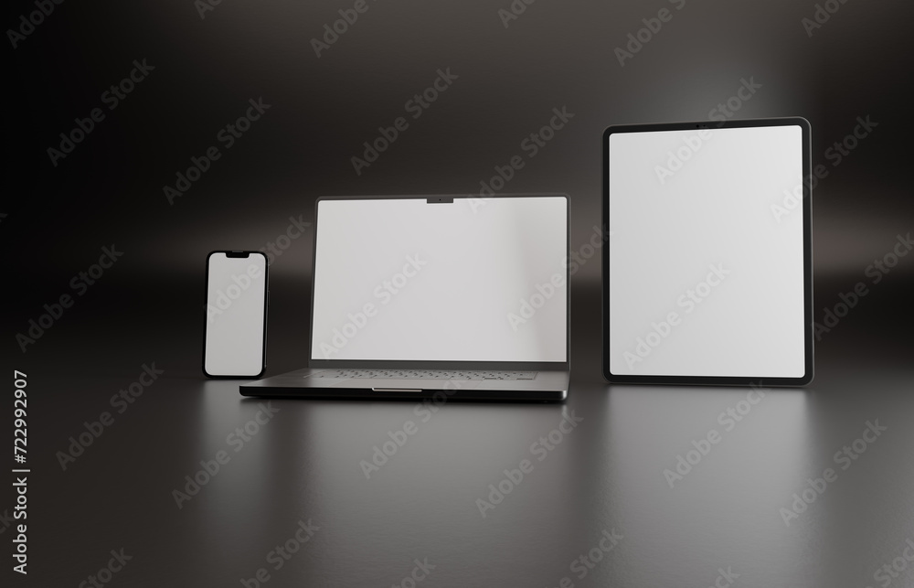 High end phone, tablet and laptop on black studio backdrop. Blank ...