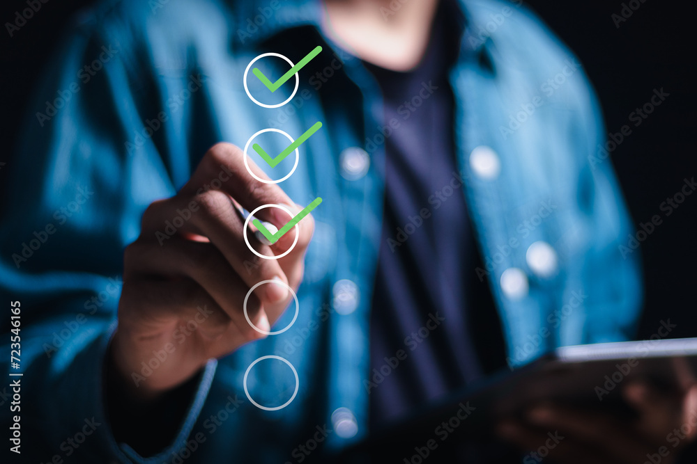 Checklist concept. Businessman use tablet and checking mark on ...