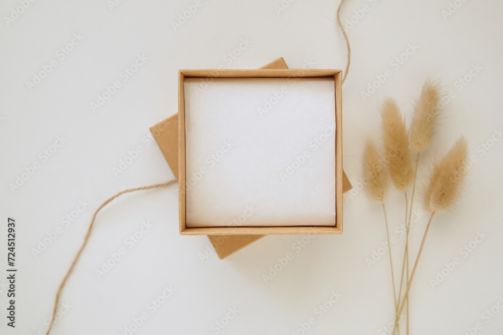 Small square open gift or product box made from brown cardboard, mockup ...
