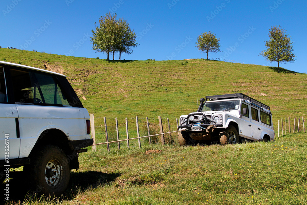 Land Rover Defender 110 (2012) towed from mud by Range Rover Classic ...