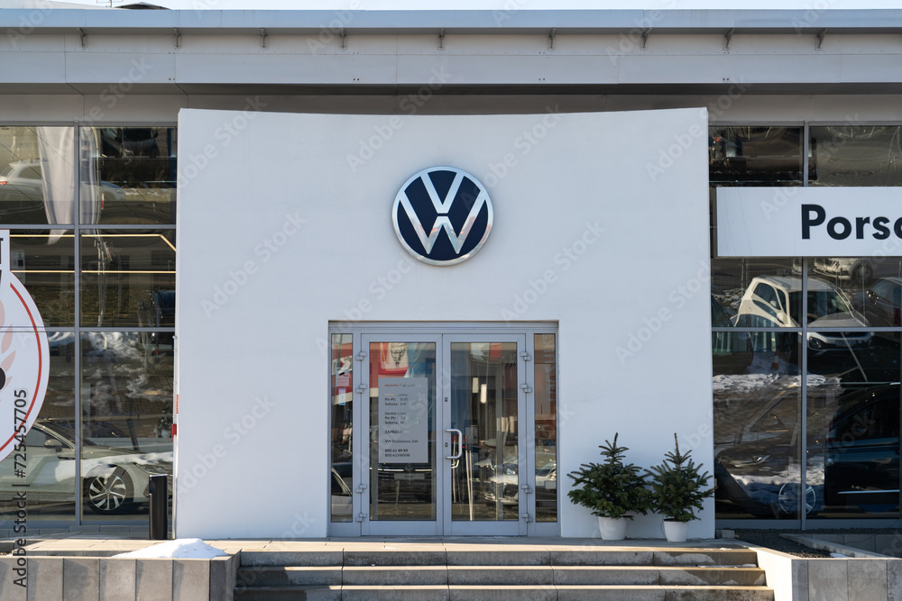 Volkswagen logo sign on VW car dealership building. German automobile ...