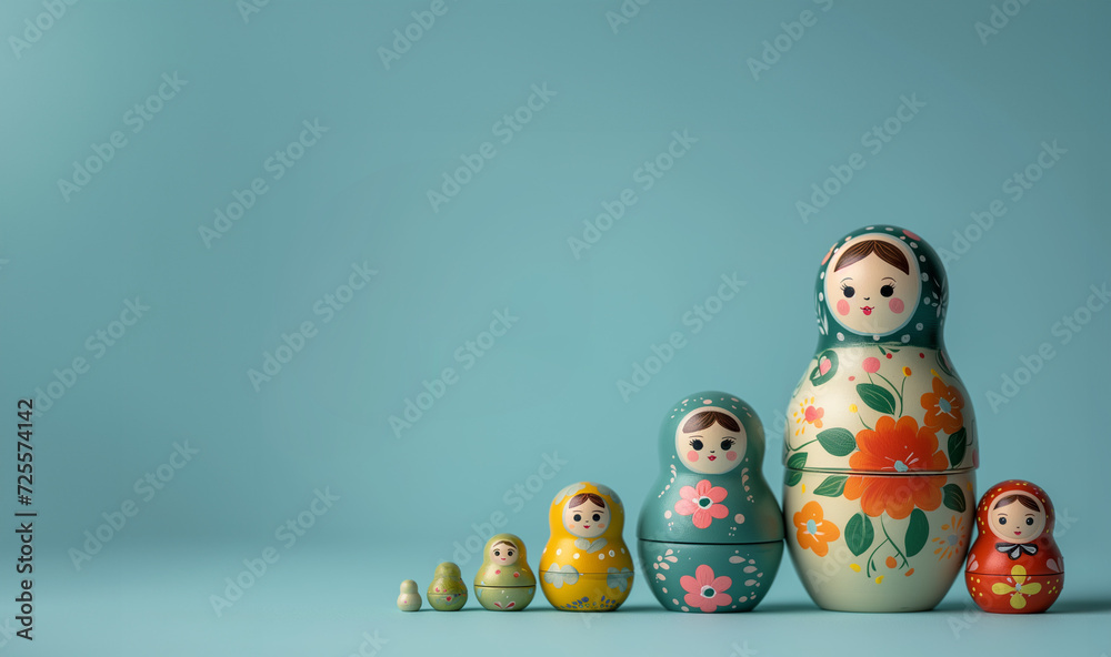 big to tiny traditional matryoshka nesting dolls isolated on plain blue ...