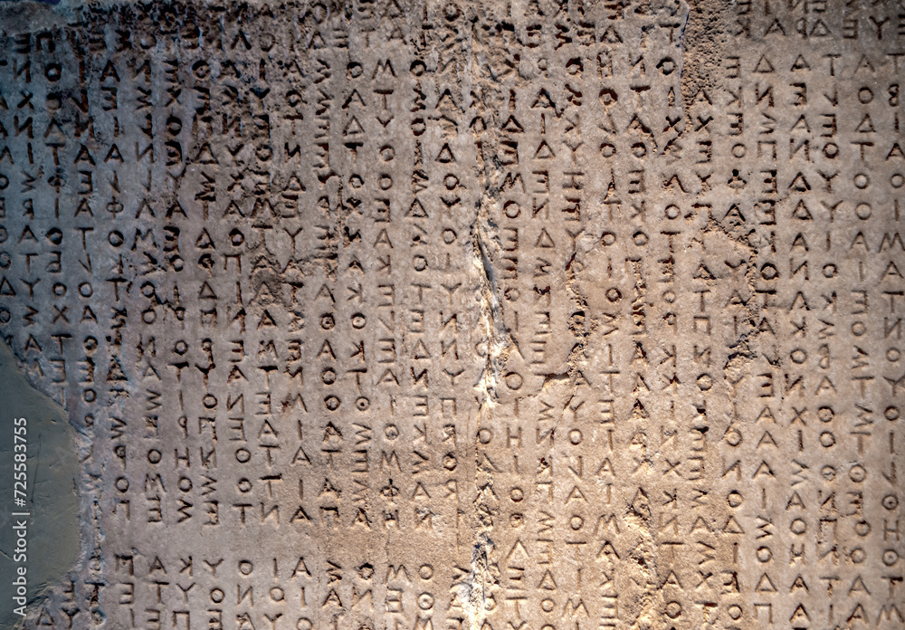 ancient greek letters in stone Stock Photo | Adobe Stock