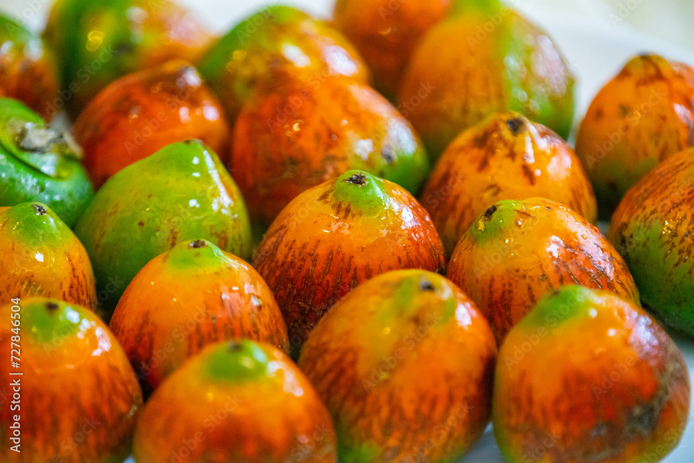 Rare and exotic fruit of the peach palm (Bactris gasipaes), typical ...