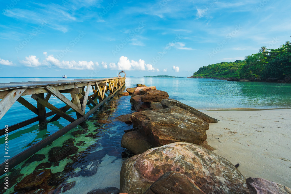 The wooden bridge in the sea at Koh Kood is a tropical island with ...