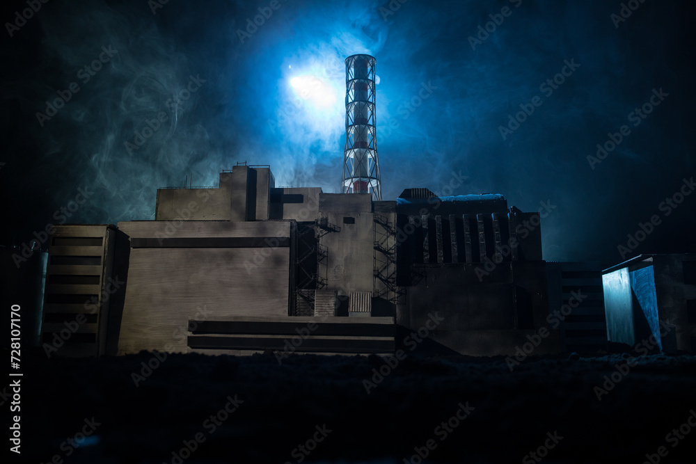 Creative artwork decoration. Chernobyl nuclear power plant at night ...