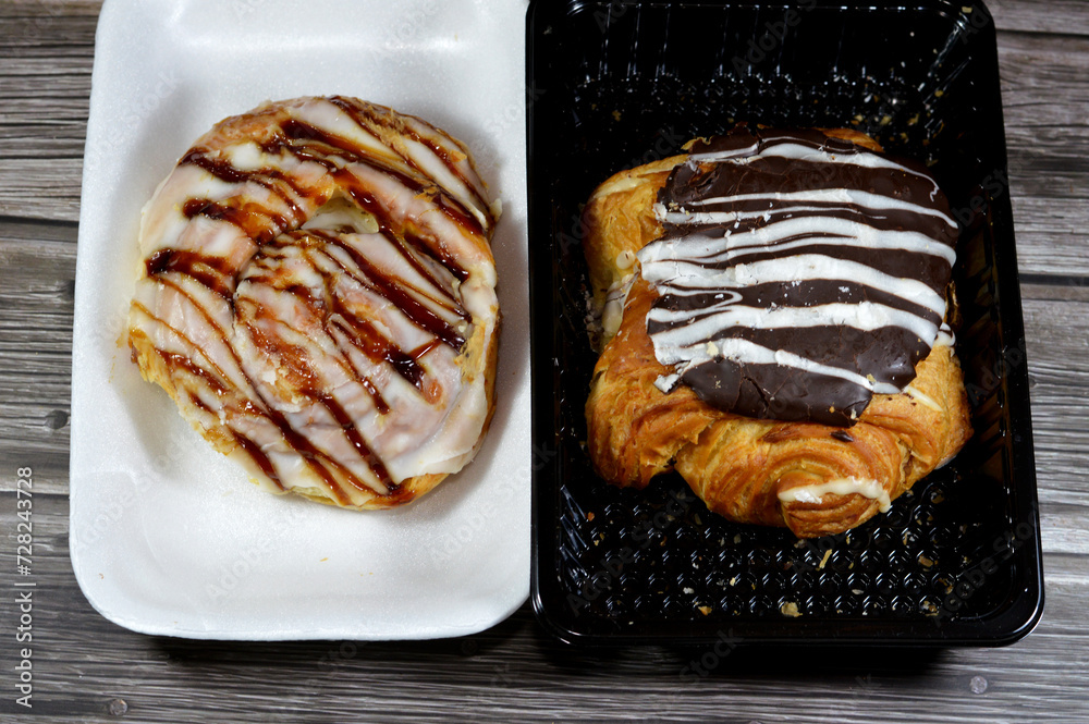Danish pastry stuffed and topped with brown dark chocolate, white ...