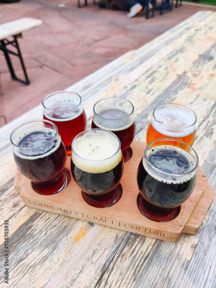 Beer samples on beer garden outside restaurant table drink background ...